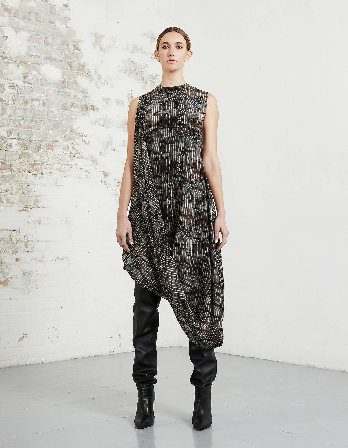 Sleek clan-style gown featuring high neck with zip fastening at back ...